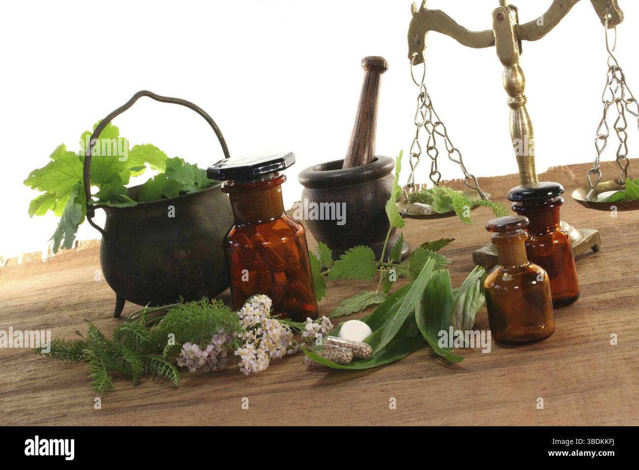 Apothecary scales with mortar, old pot, apothecary bottle and fresh ...
