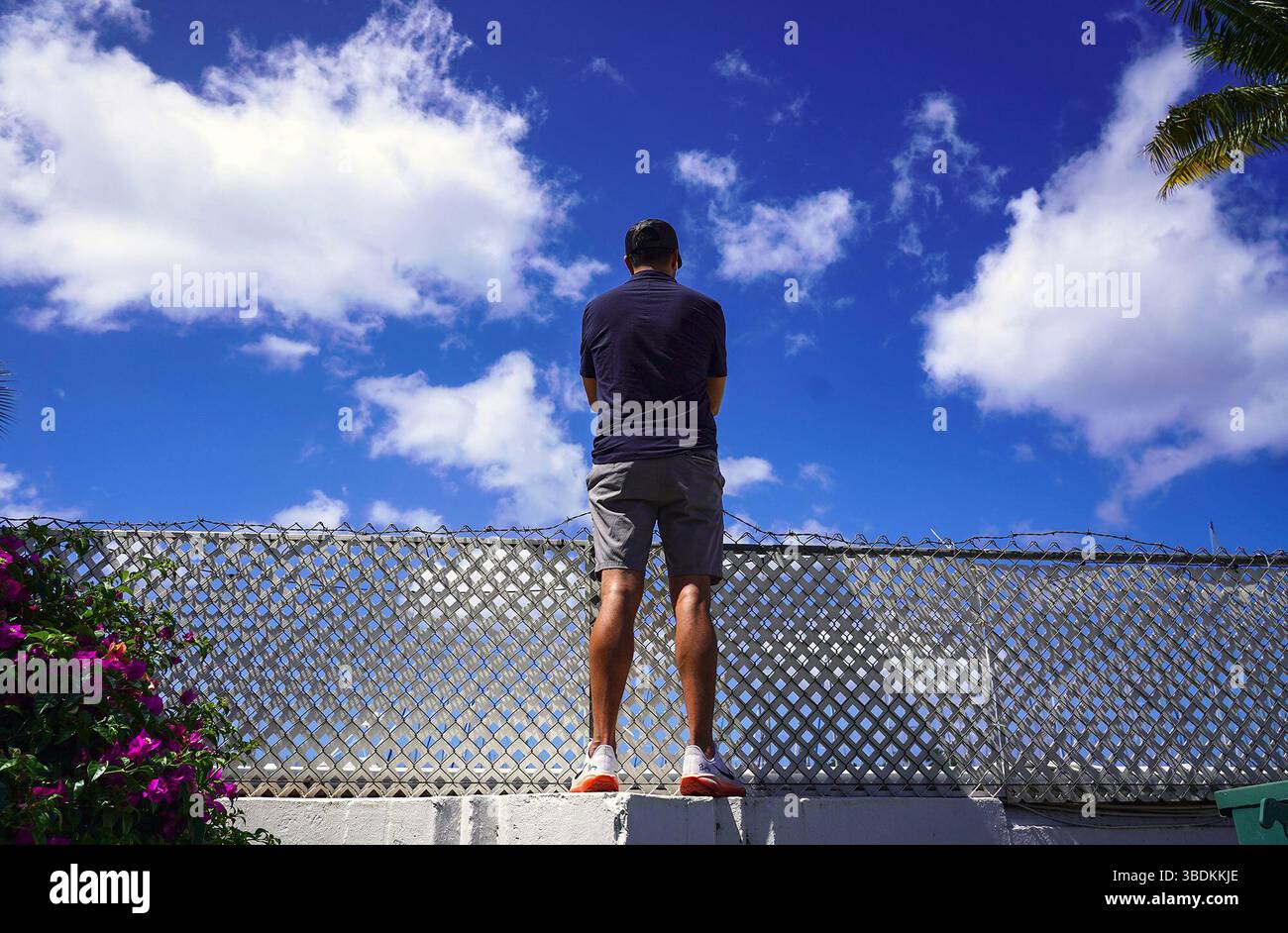 Collin Johnson stands on a wall to wait for Oliver Widger, 29-year-old ...