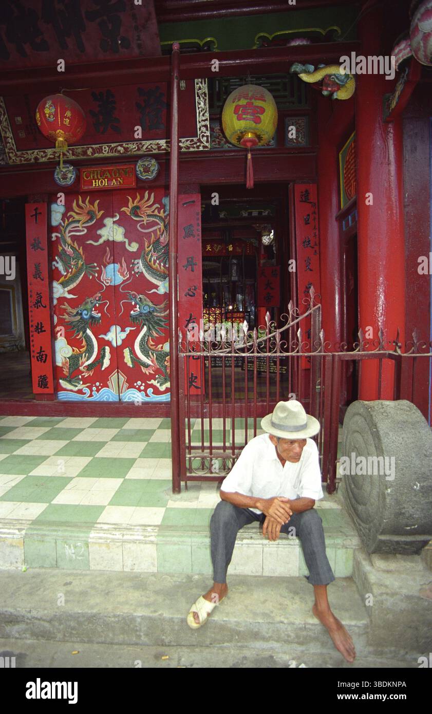 Old man on the steps of a Buddhist temple, Hoi An, Buddhist temple ...