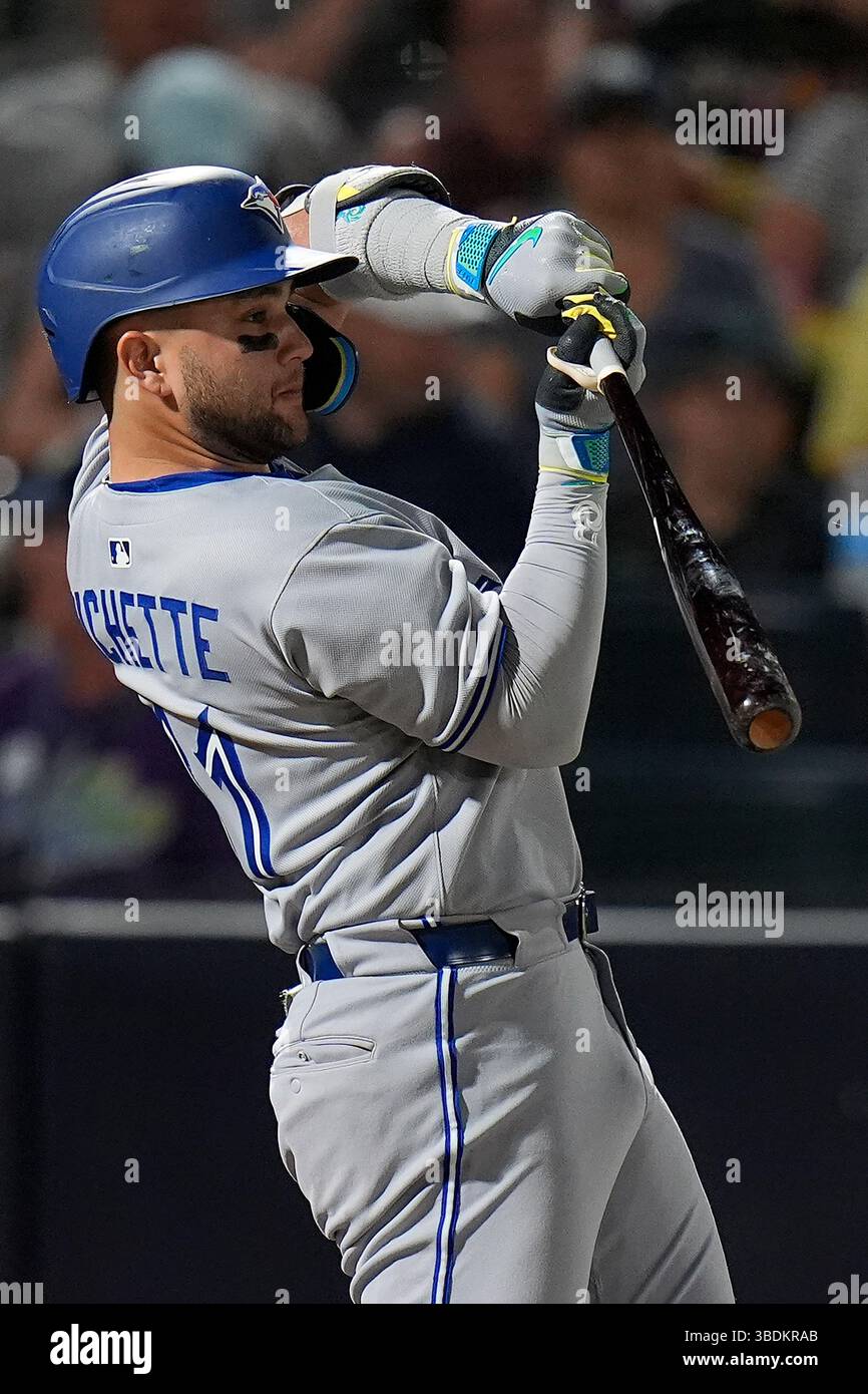 Toronto Blue Jays' Bo Bichette takes an awkward swing at a pitch from ...