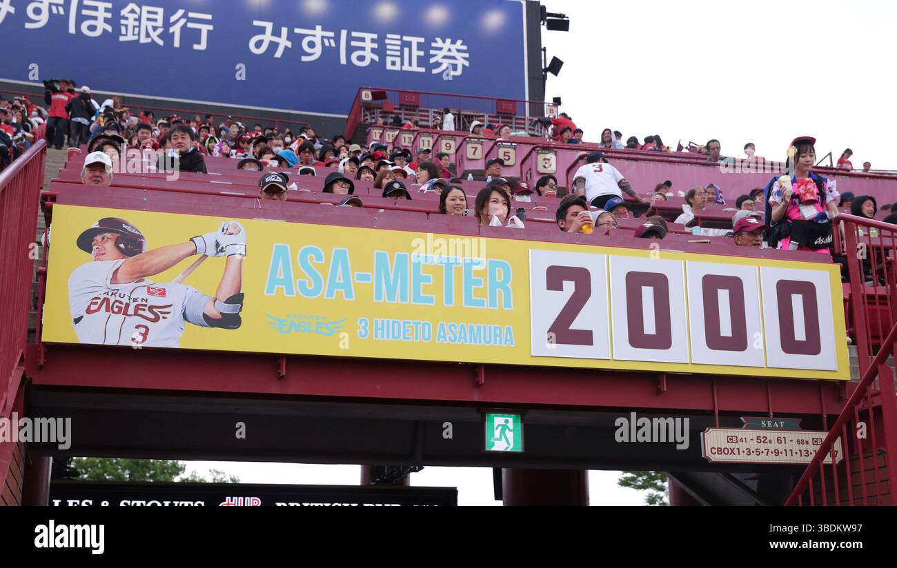A photo shows the "ASA-METER" marking Asamura's 2,000th career hit at ...