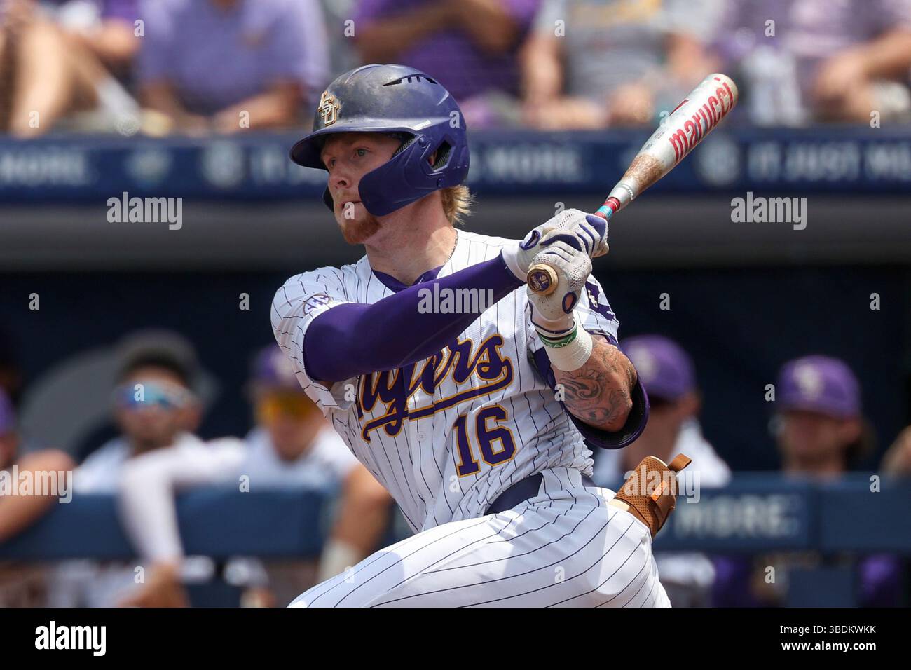 HOOVER, AL - MAY 24: LSU outfielder Ethan Frey (16) watches his line drive to third during the ...