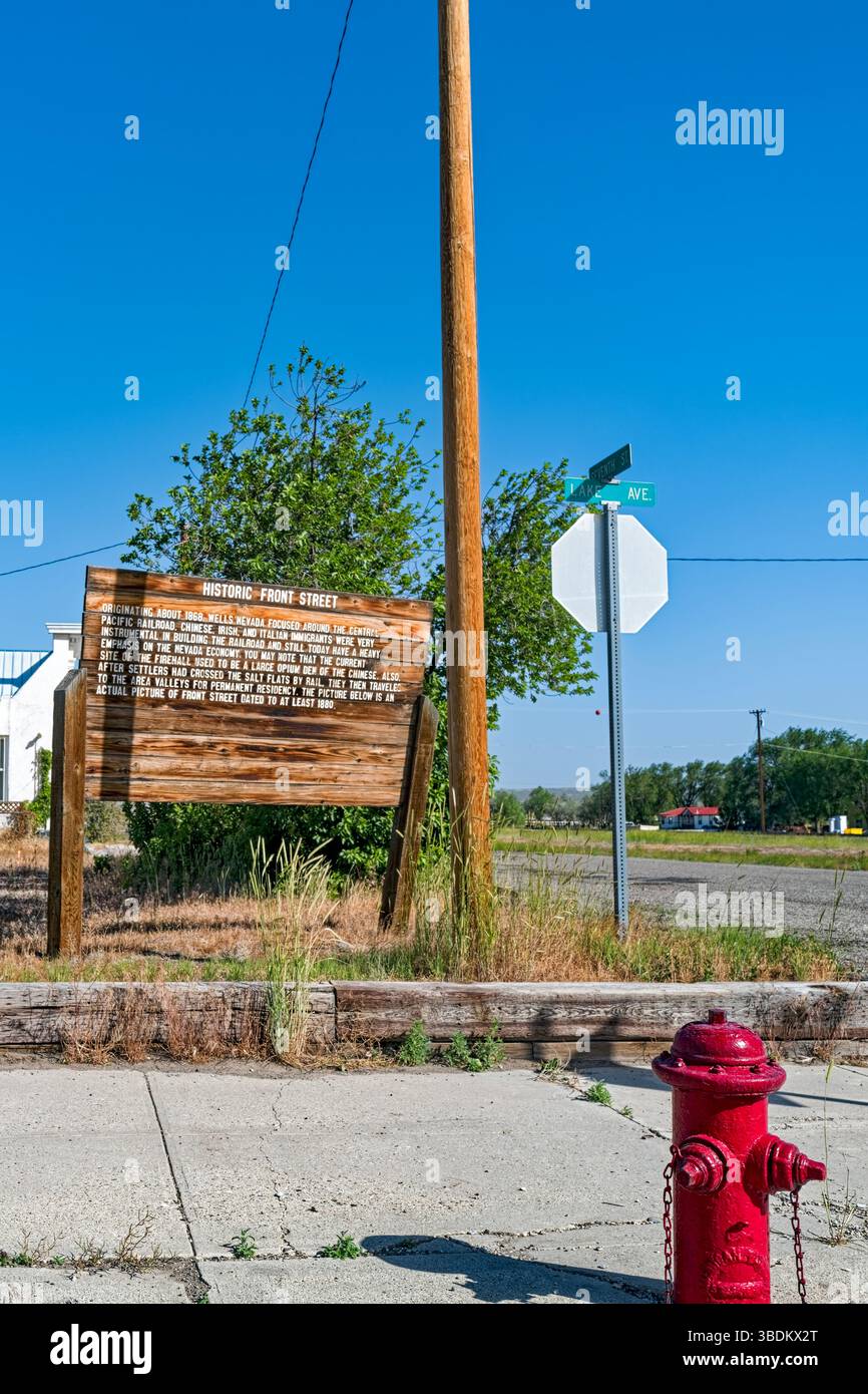 A broken wooden sign describing Historic Front Street in Wells, Nevada ...