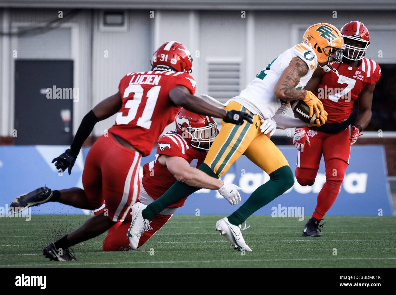 Calgary, Canada. 24th May, 2025. Edmonton Elks' Zach Mathis, centre ...