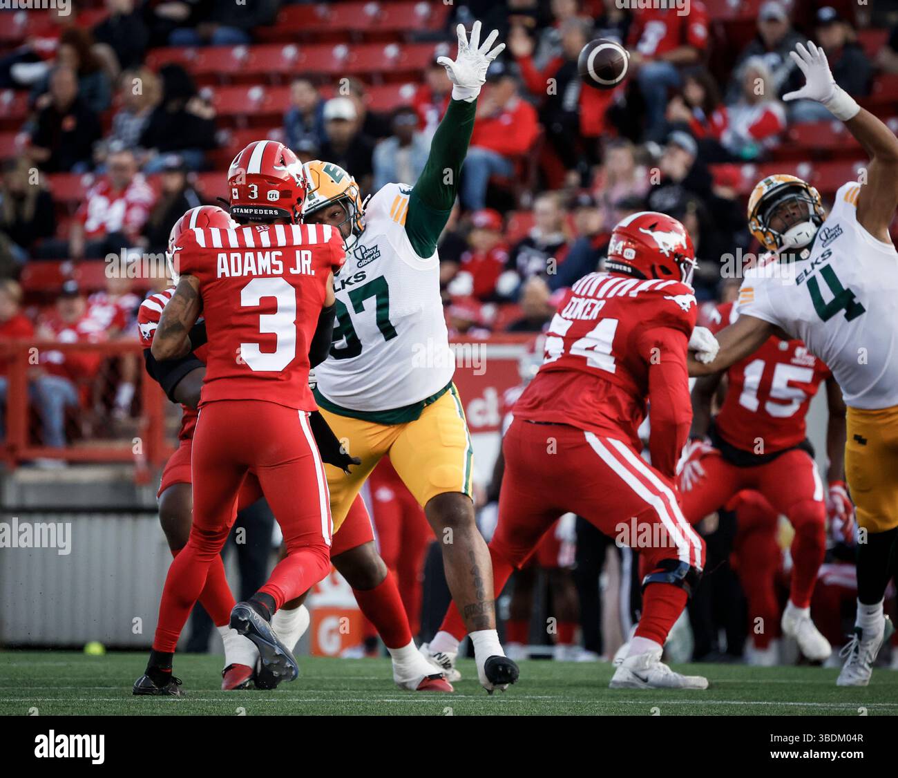 Edmonton Elks' Quincy Ledet, right, tries to block a pass from Calgary ...