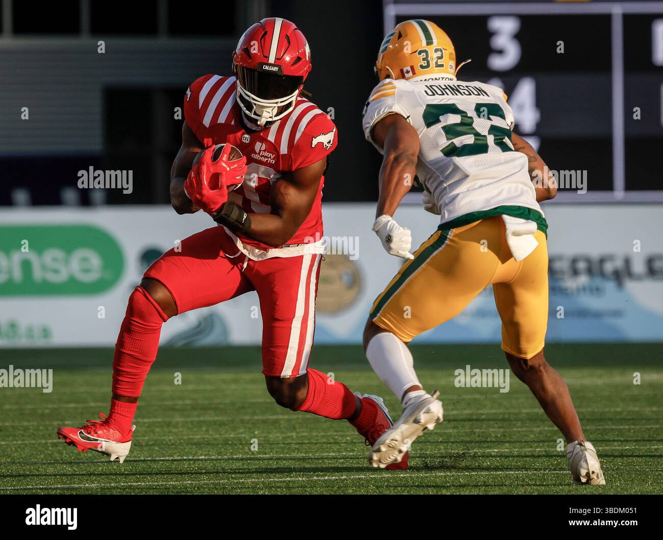 Calgary, Canada. 24th May, 2025. Edmonton Elks' Leonard Johnson, right ...