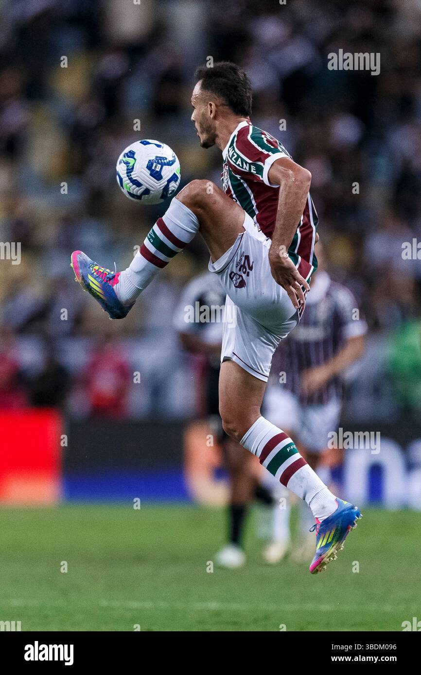 RIO DE JANEIRO, BRAZIL - MAY 24: Rene Rodrigues of Fluminense controls ...