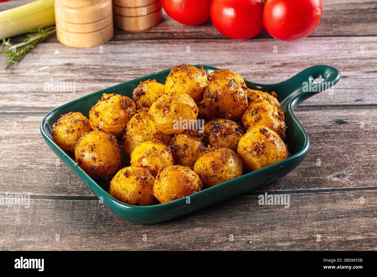 Baked small baby potato with herbs and spices Stock Photo - Alamy
