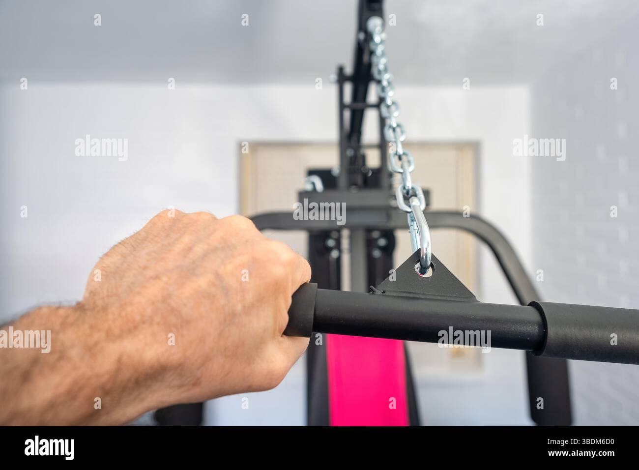 Man hand pulling a barbell to do bodybuilding exercises on a gym ...