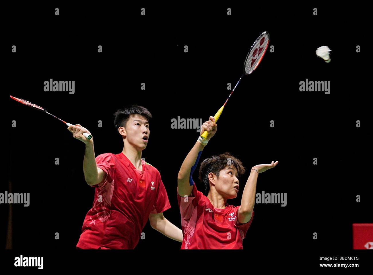 China's Huang Dong Ping, right and Feng Yan Zhe play against compatriots Jiang Zhen Bang and Wei ...