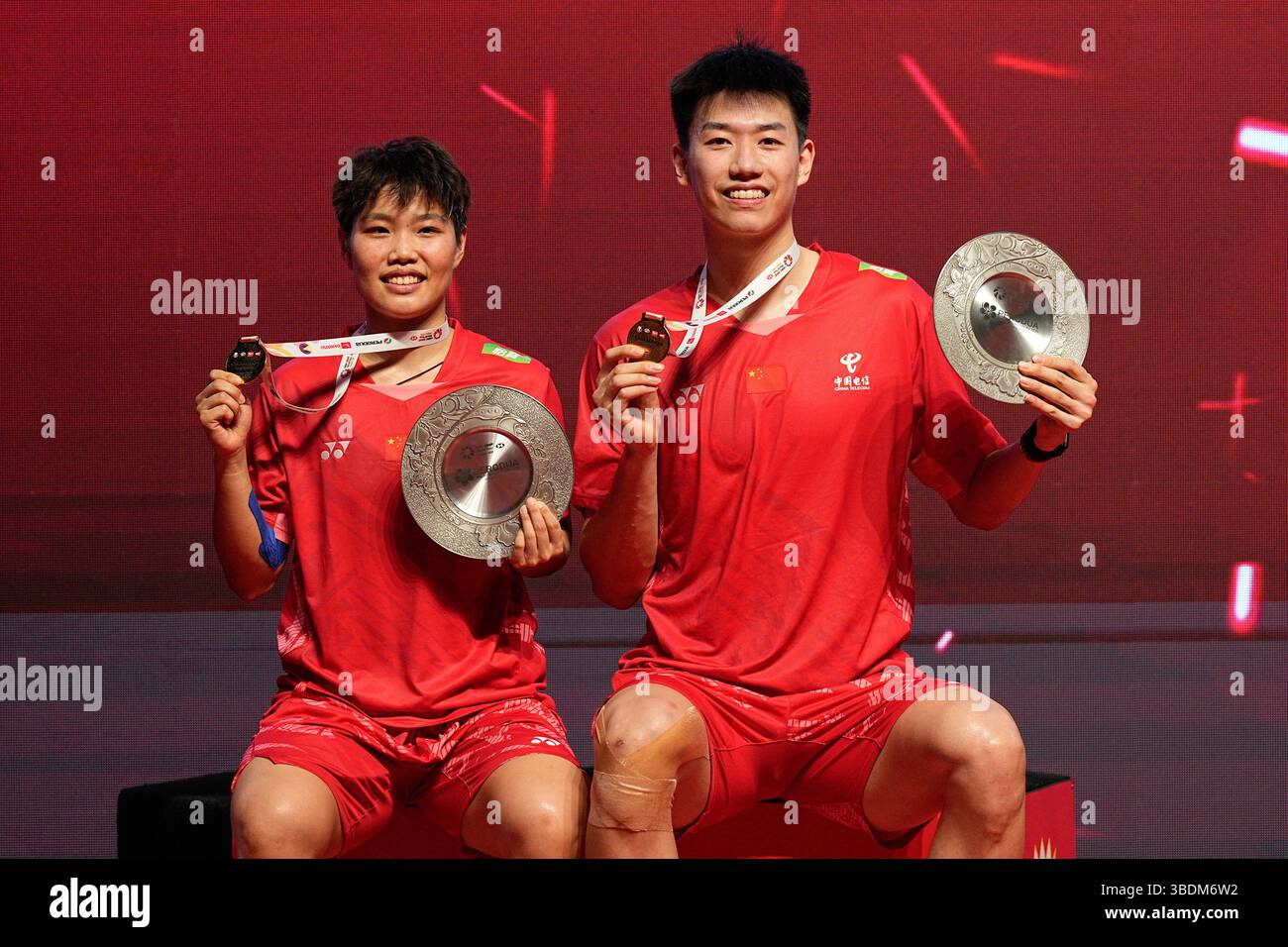 Winners China's Feng Yan Zhe, right, and Huang Dong Ping pose on the ...