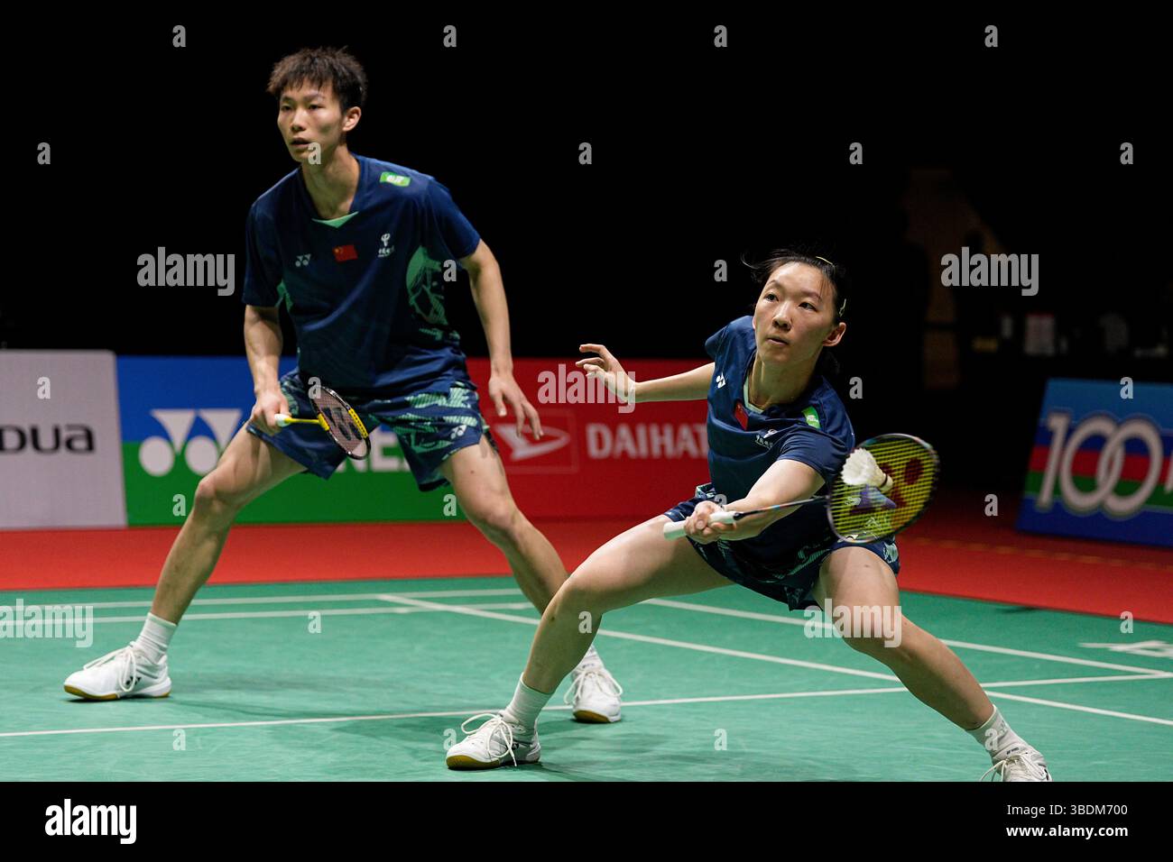 China's Wei Ya Xin, front, and Jiang Zhen Bang play against compatriots ...