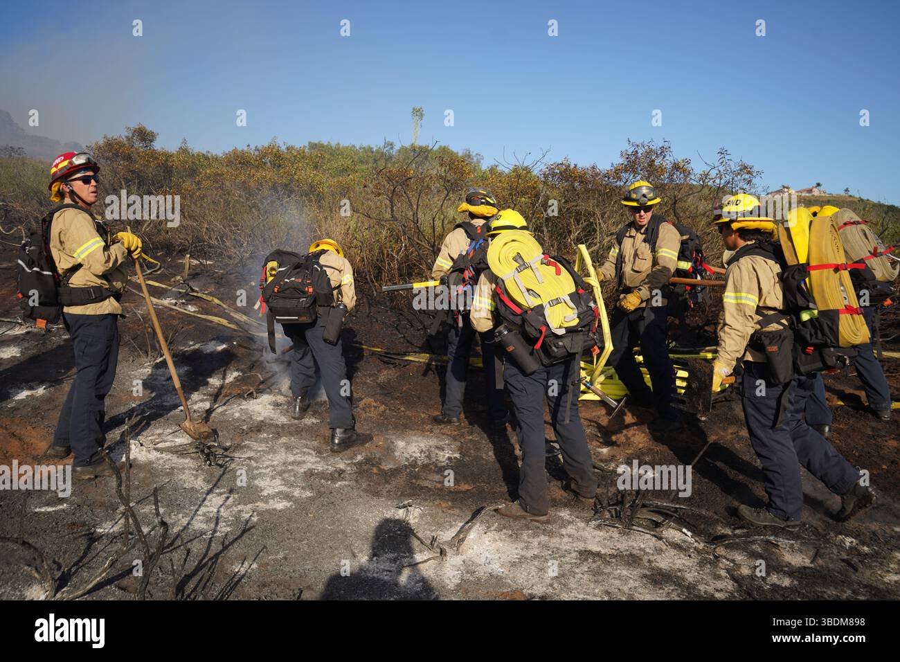Poway, United States. 24th May, 2025. Firefighters contain the fire on ...