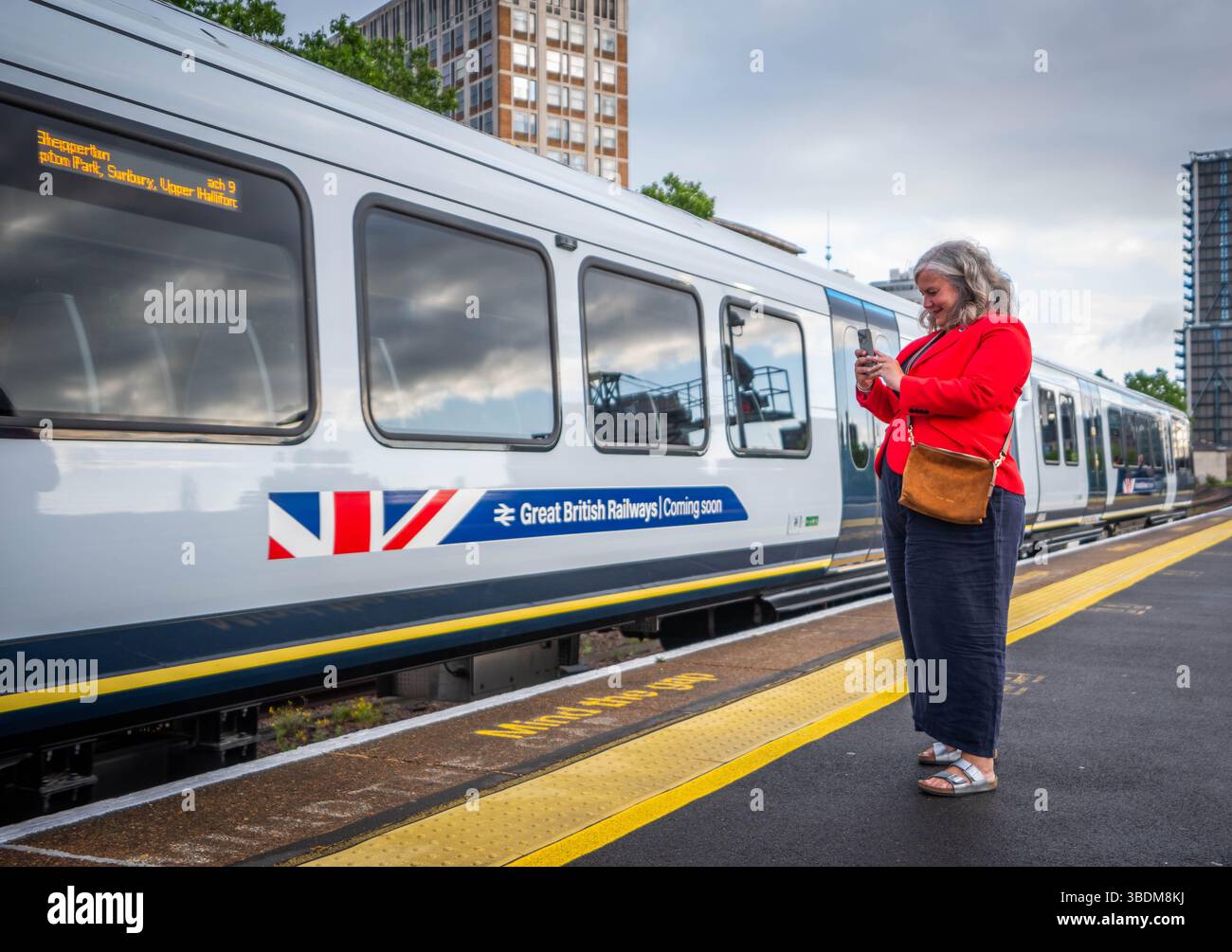 Transport Secretary Heidi Alexander takes a photo of a train, after ...