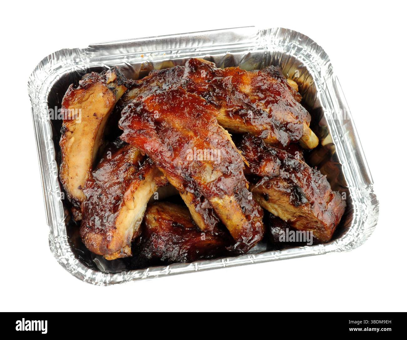 Hoisin sauce Chinese pork ribs in a foil take away tray isolated on a ...