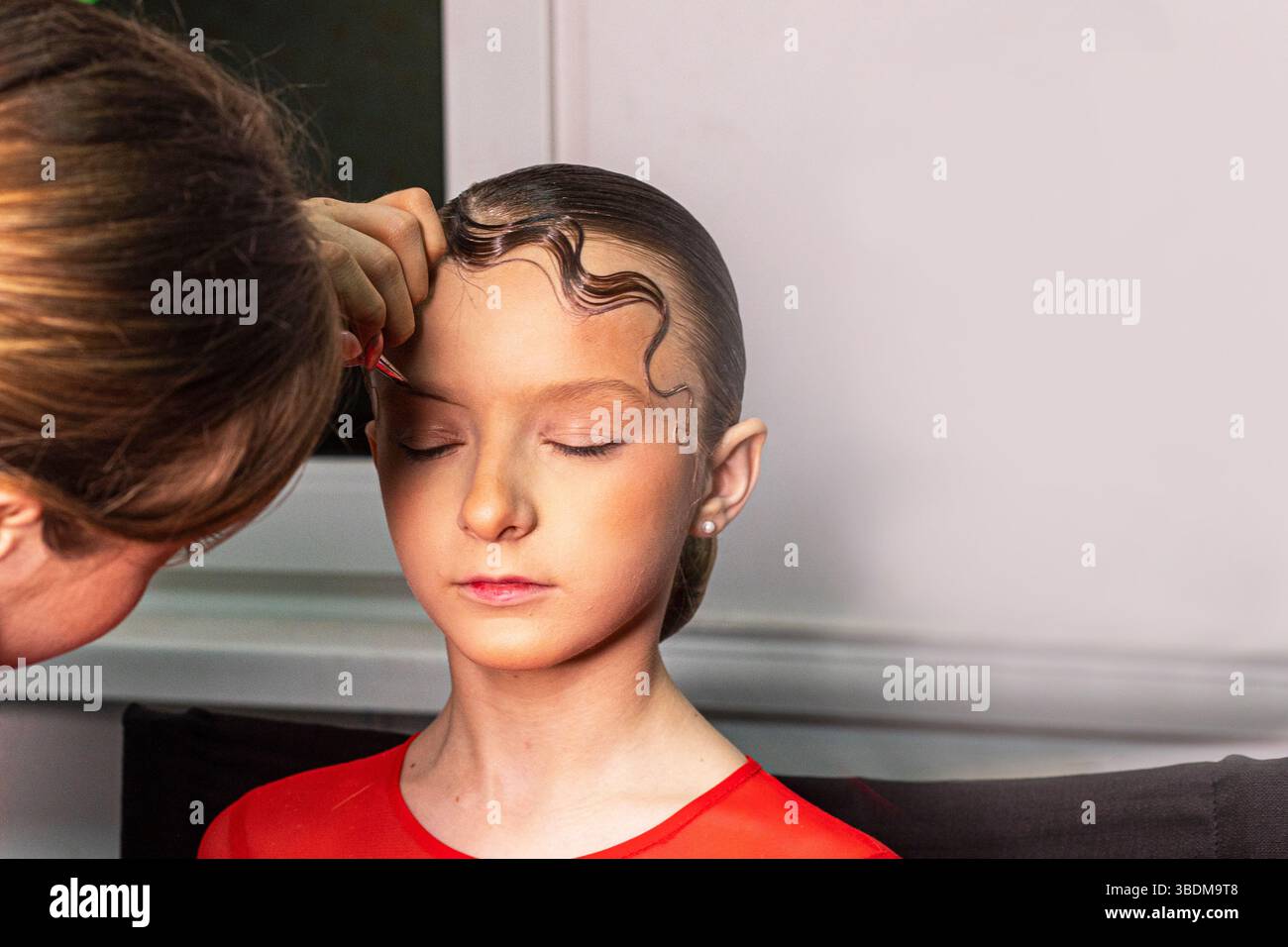 master creates professional makeup for a girl in ballroom dancing ...