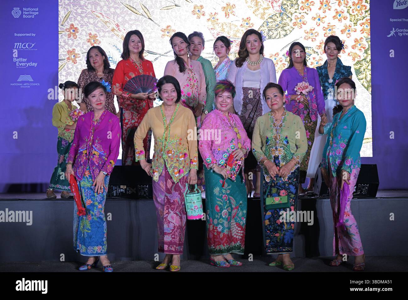 Singapore. 24th May, 2025. Nyonya models showcase traditional peranakan costumes at a fashion ...