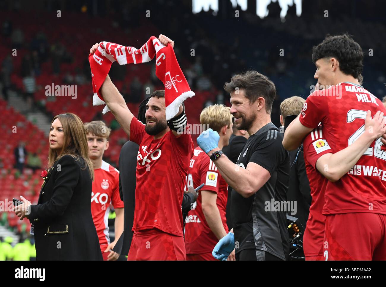 Aberdeen captain graeme shinnie waves the scarf during celebrationsv hi ...