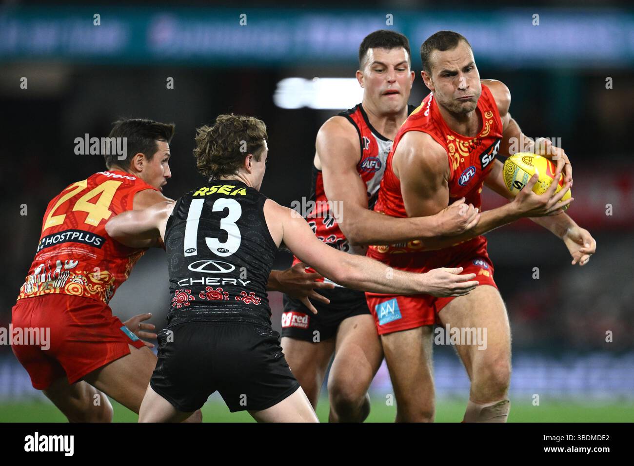 Melbourne, Australia. 25th May, 2025. Rowan Marshall of St Kilda tackles Jarrod Witts of the ...