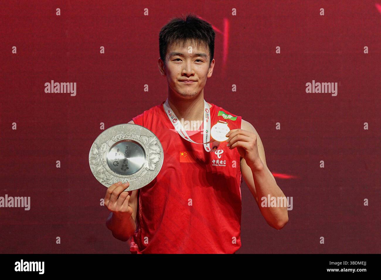 Winners China's Li Shi Feng poses on the podium after defeating India's ...
