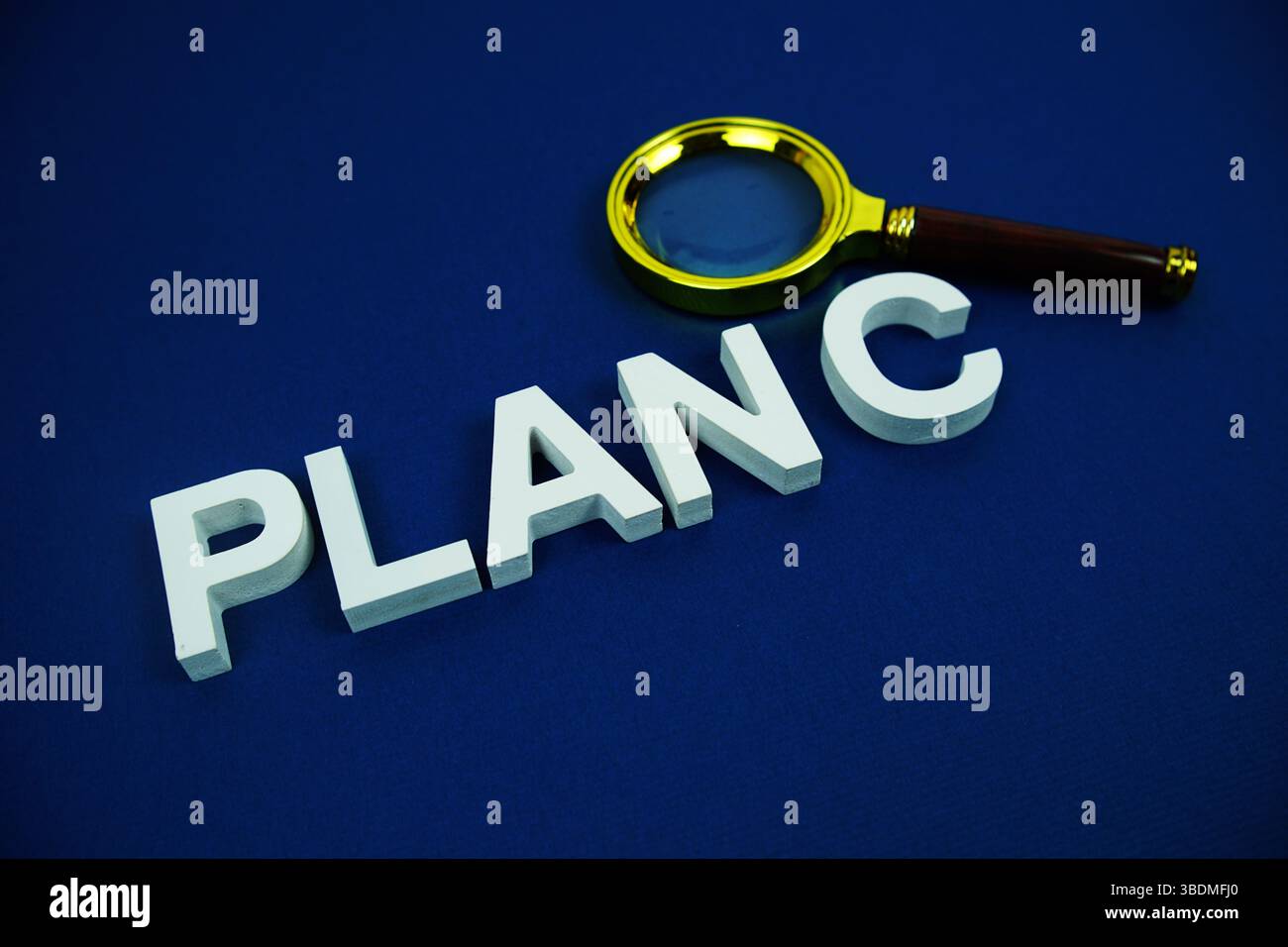 Plan C alphabet letters with magnifying glass top view Stock Photo - Alamy