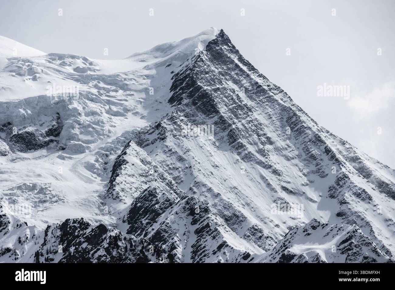 The dramatic summit of the Aiguille du Goûter, a beautiful mountain in ...