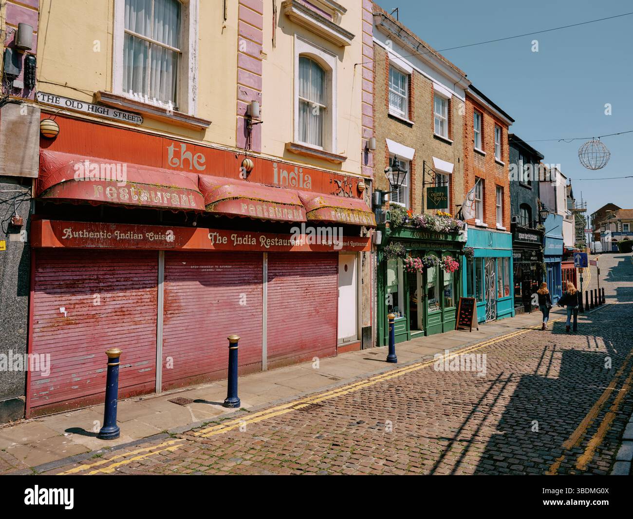 The colourful streets and shop buildings of old town High Street ...
