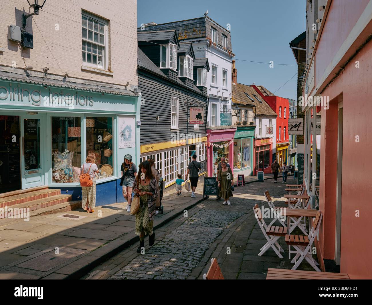 The colourful streets and cafe shop buildings of old town Folkestone ...