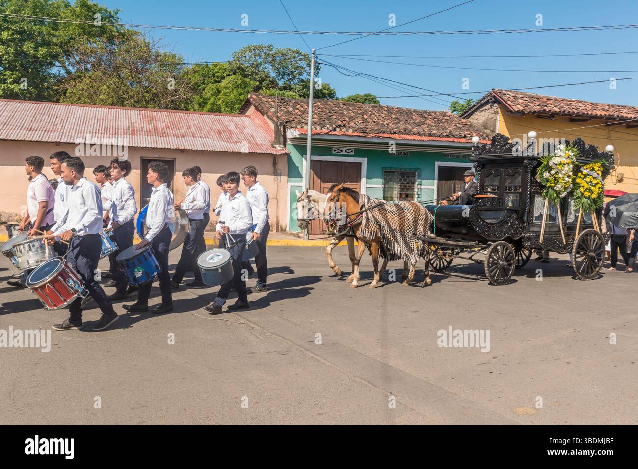 Funeral procession. Music group marching in front of a horse drawn ...