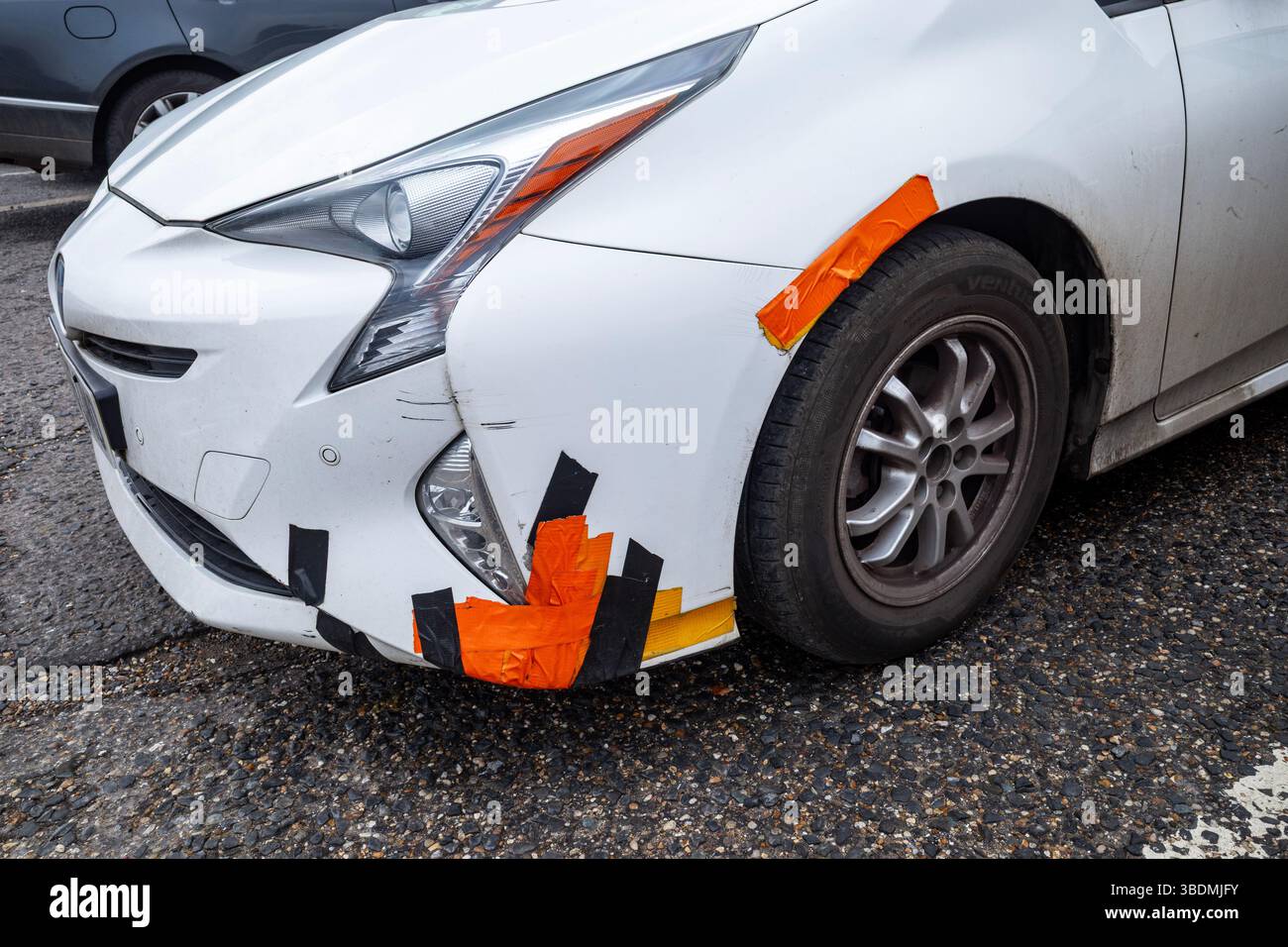 Damaged bumper on a Toyota car repaired using plastic tape Stock Photo ...