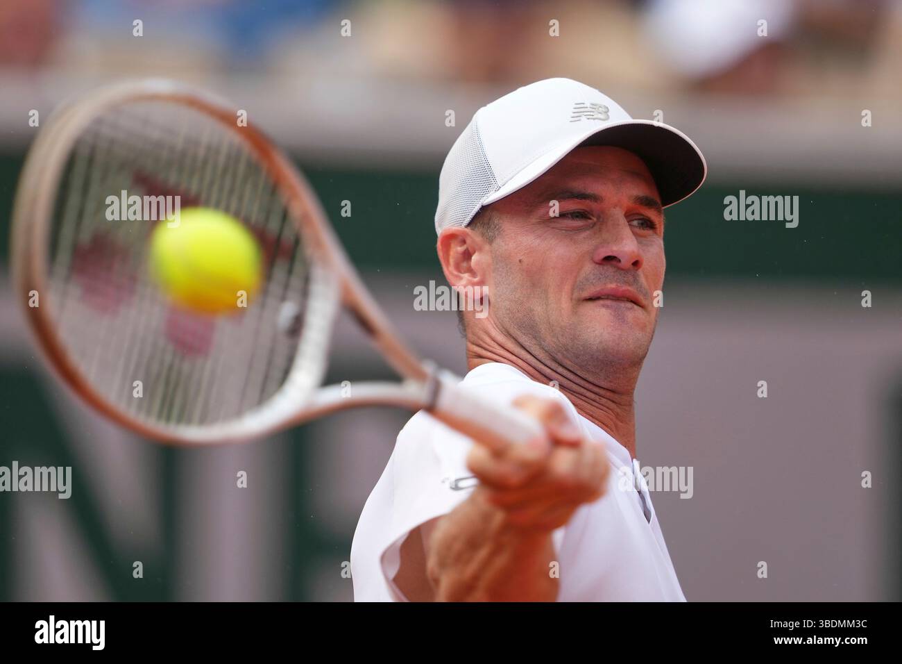 Tommy Paul of the U.S. hits a forehand against Denmark's Elmer Moller ...