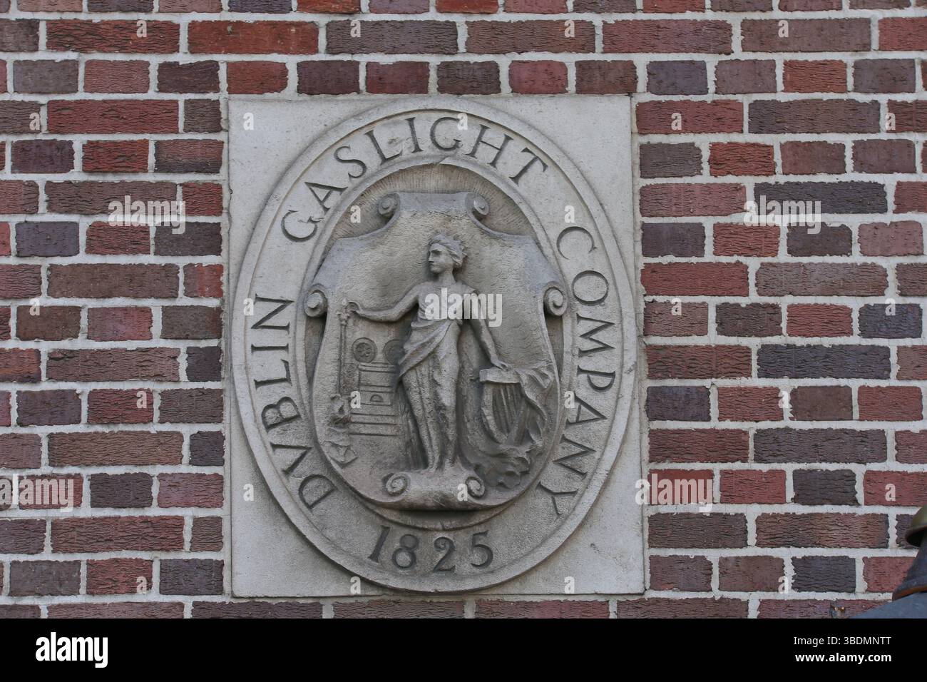 Dublin, Ireland - 30th April 2025 - A stone plaque depicting a carved ...