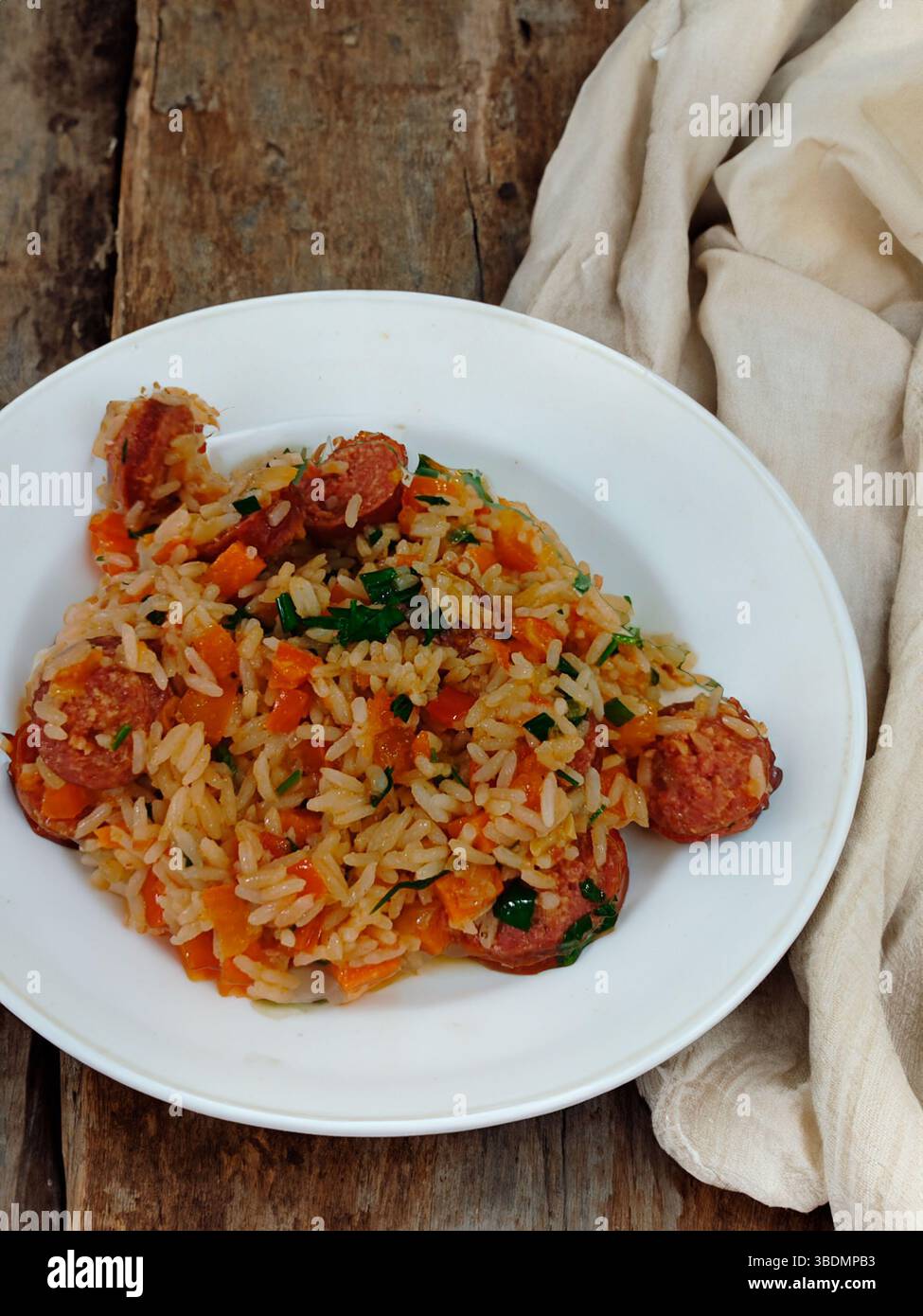 Traditional rustic Brazilian popular food, rice with calabresa sausage ...