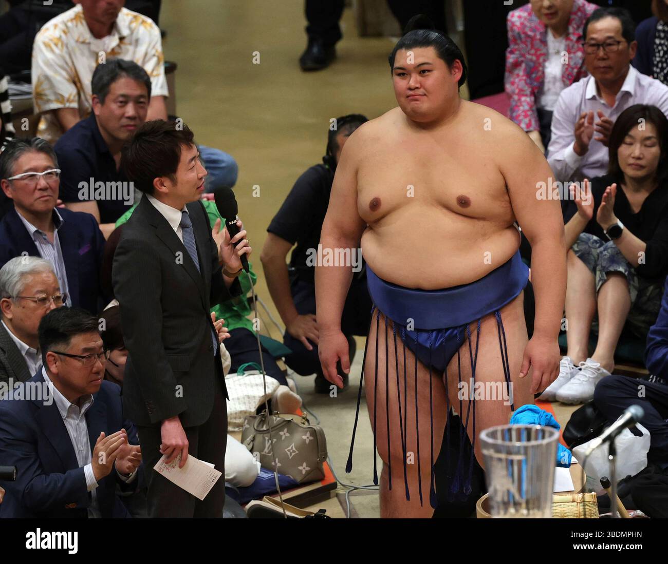 Ozeki Onosato (R) gives victory interview after the award ceremony of the May Grand Sumo ...