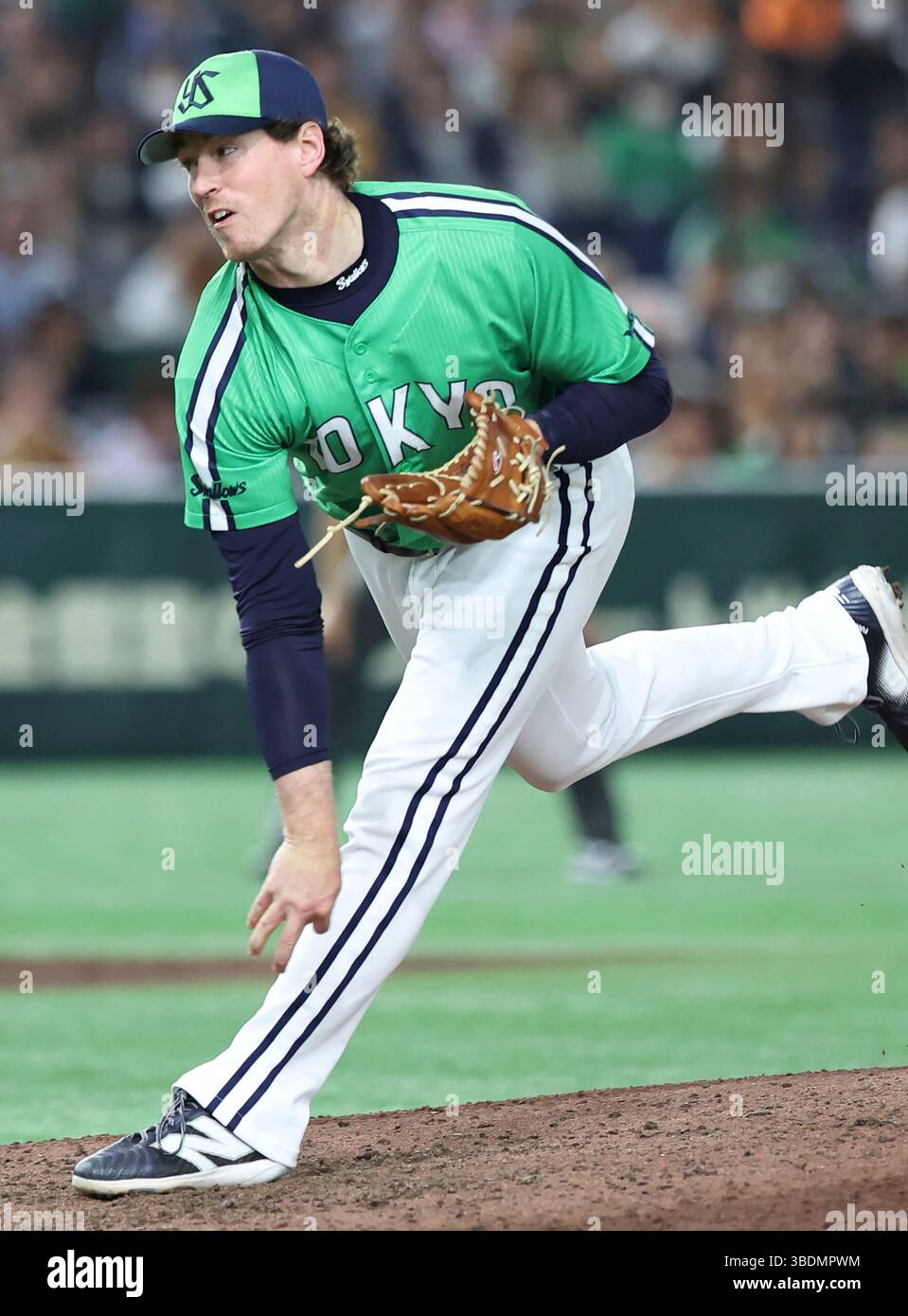 Tokyo Yakult Swallows pitcher Mike Baumann from the United States ...