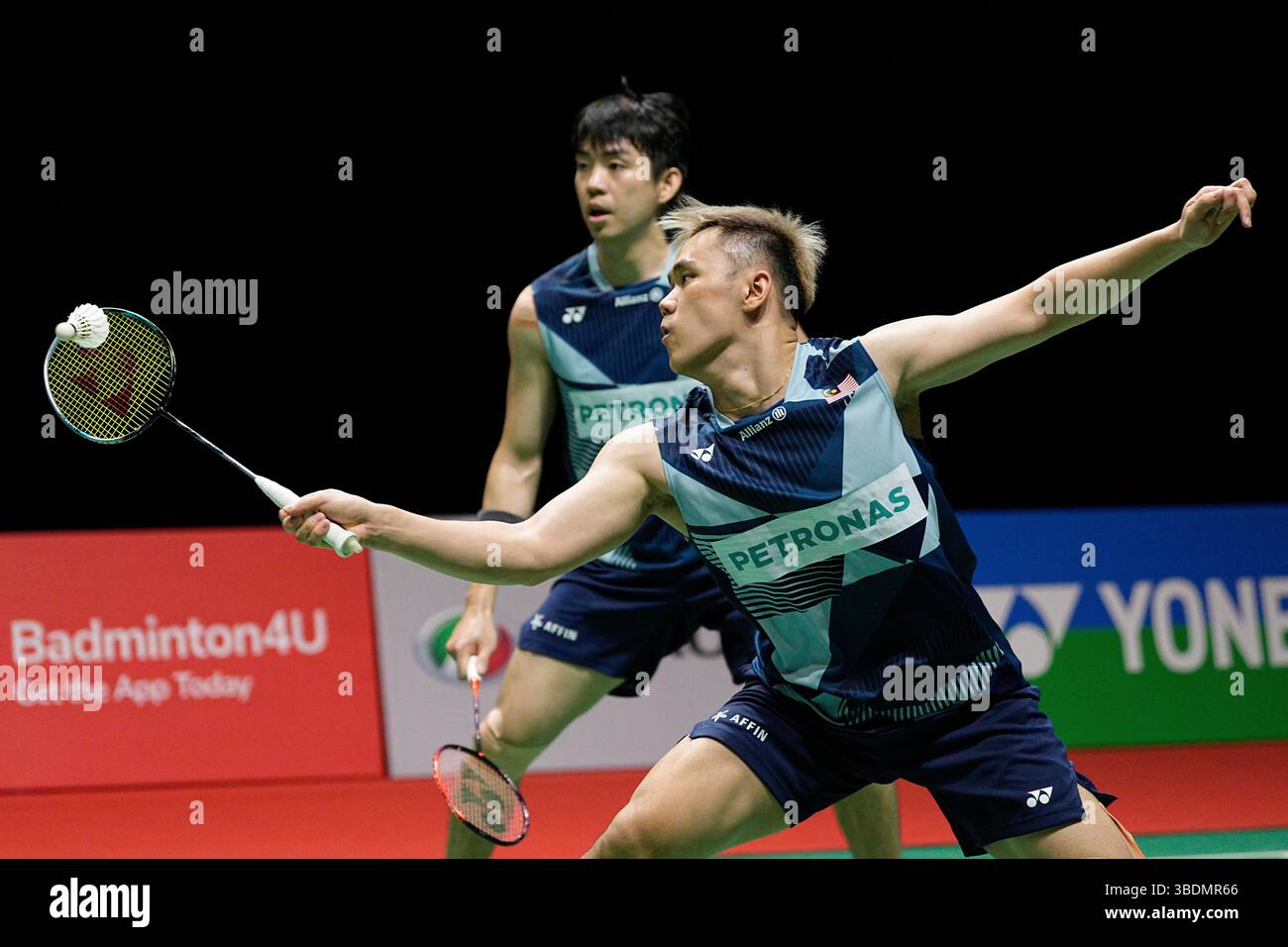 Malaysia's Tee Kai Wun, front, and Man Wei Chong play against compatriots Aaron Chia and Soh ...