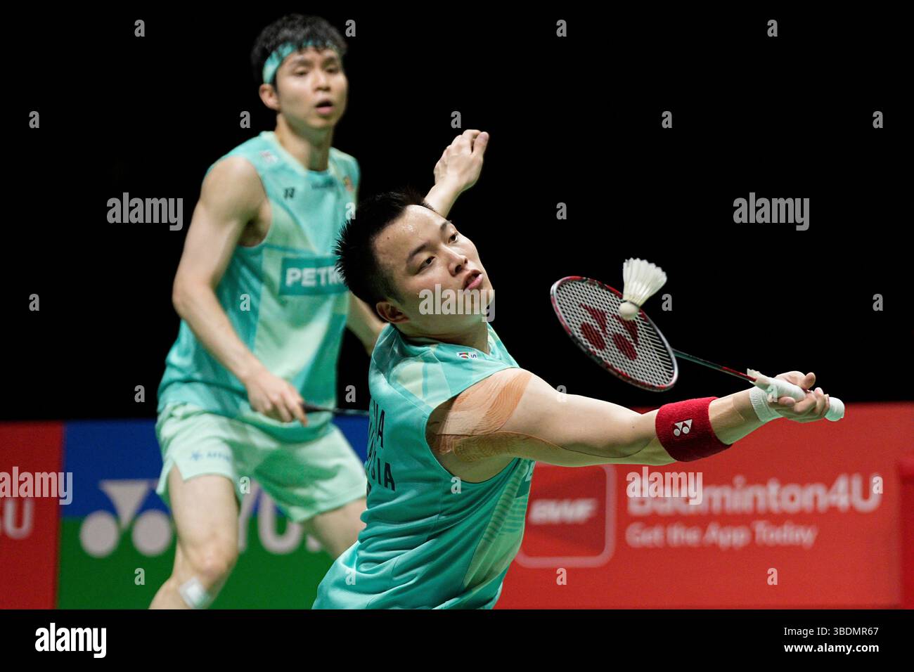 Malaysia's Aaron Chia, front, and Soh Wooi Yik play against compatriots Man Wei Chong and Tee ...