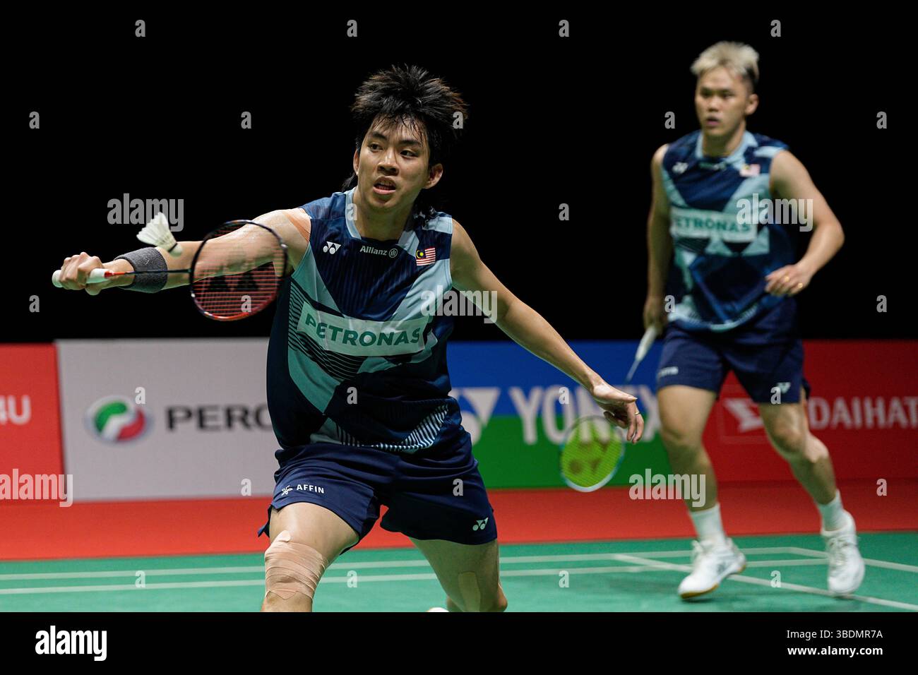 Malaysia's Man Wei Chong, left, and Tee Kai Wun play against compatriots Aaron Chia and Soh Wooi ...