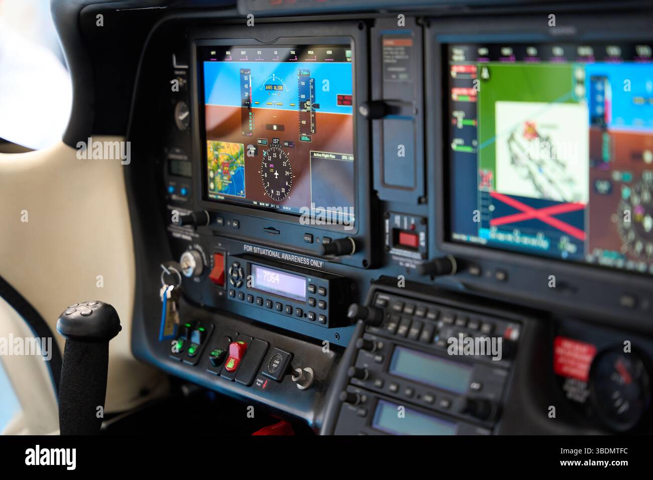 Modern aircraft cockpit control panel showing flight data and ...