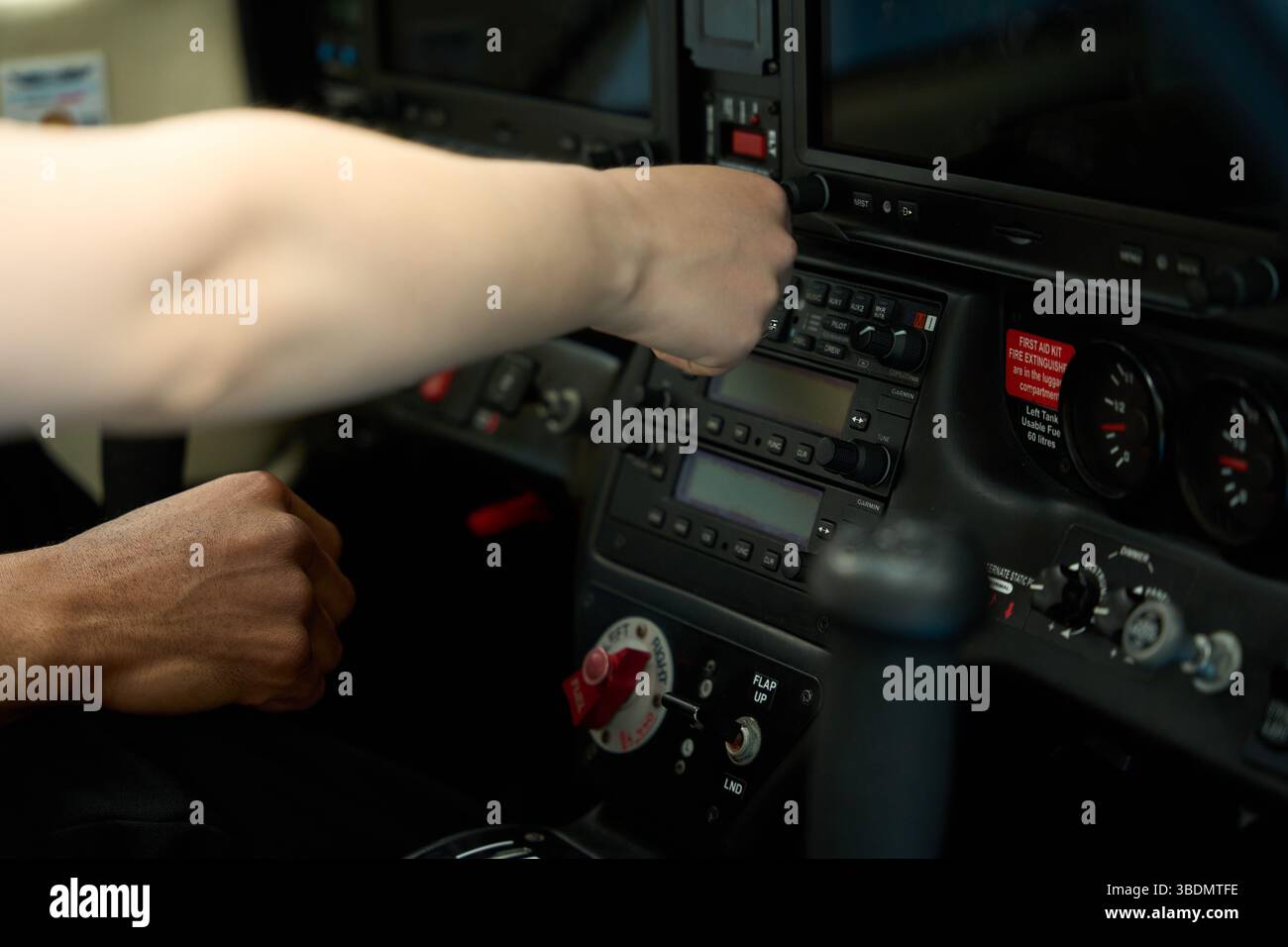 Student pilot operating cockpit controls during flight training Stock ...