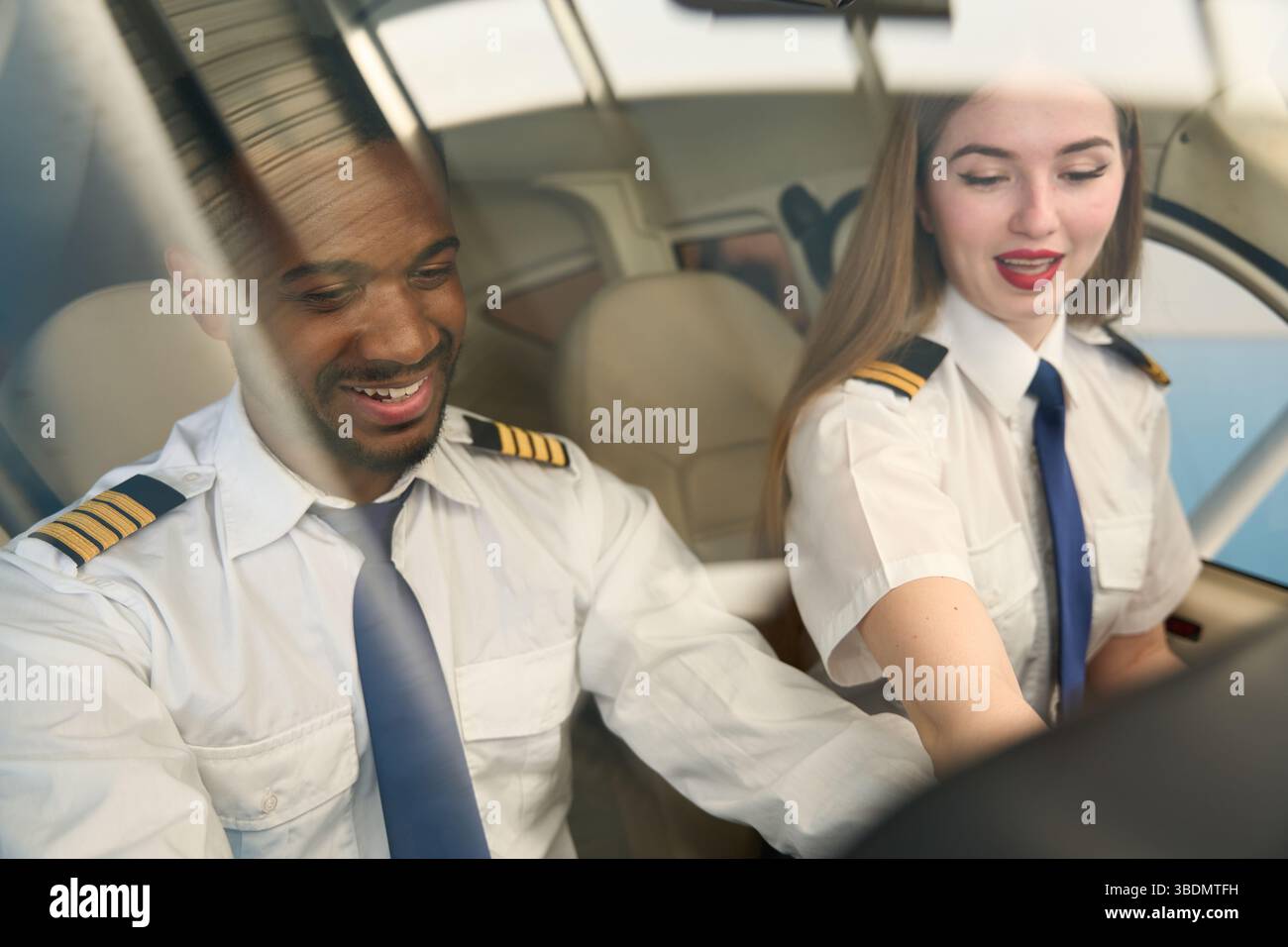 Student pilots training in cockpit: learning to fly together Stock ...