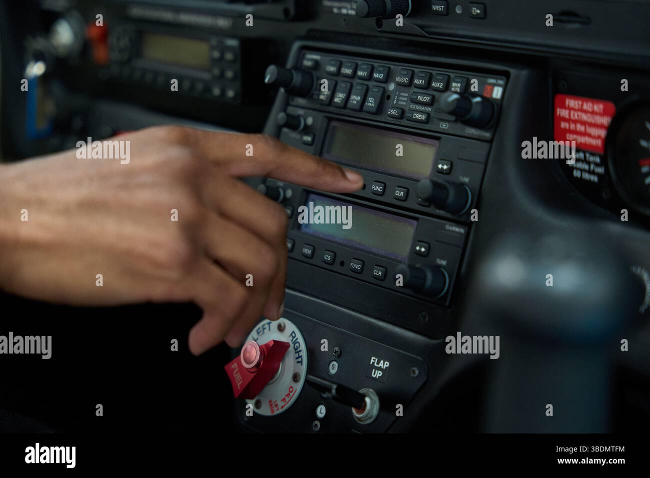 Student pilot operating aircraft cockpit controls during flight ...
