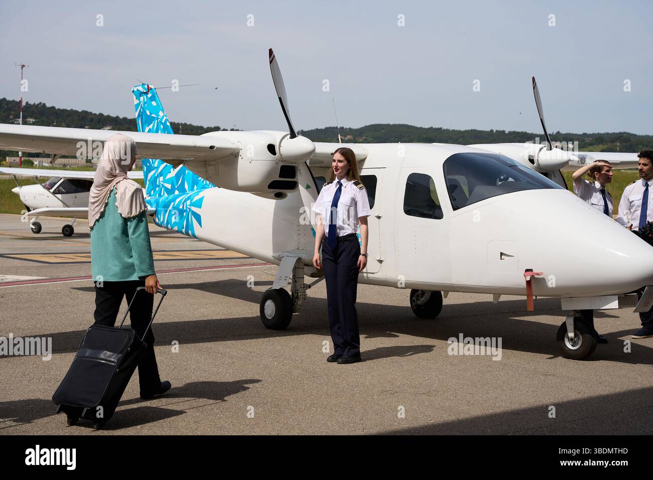 Flight school students and pilot posing with small airplane Stock Photo ...