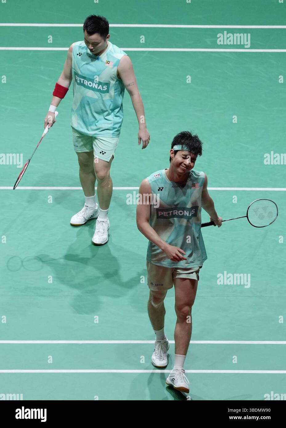 Kuala Lumpur, Malaysia. 25th May, 2025. Aaron Chia/Soh Wooi Yik (bottom) react during the men's ...