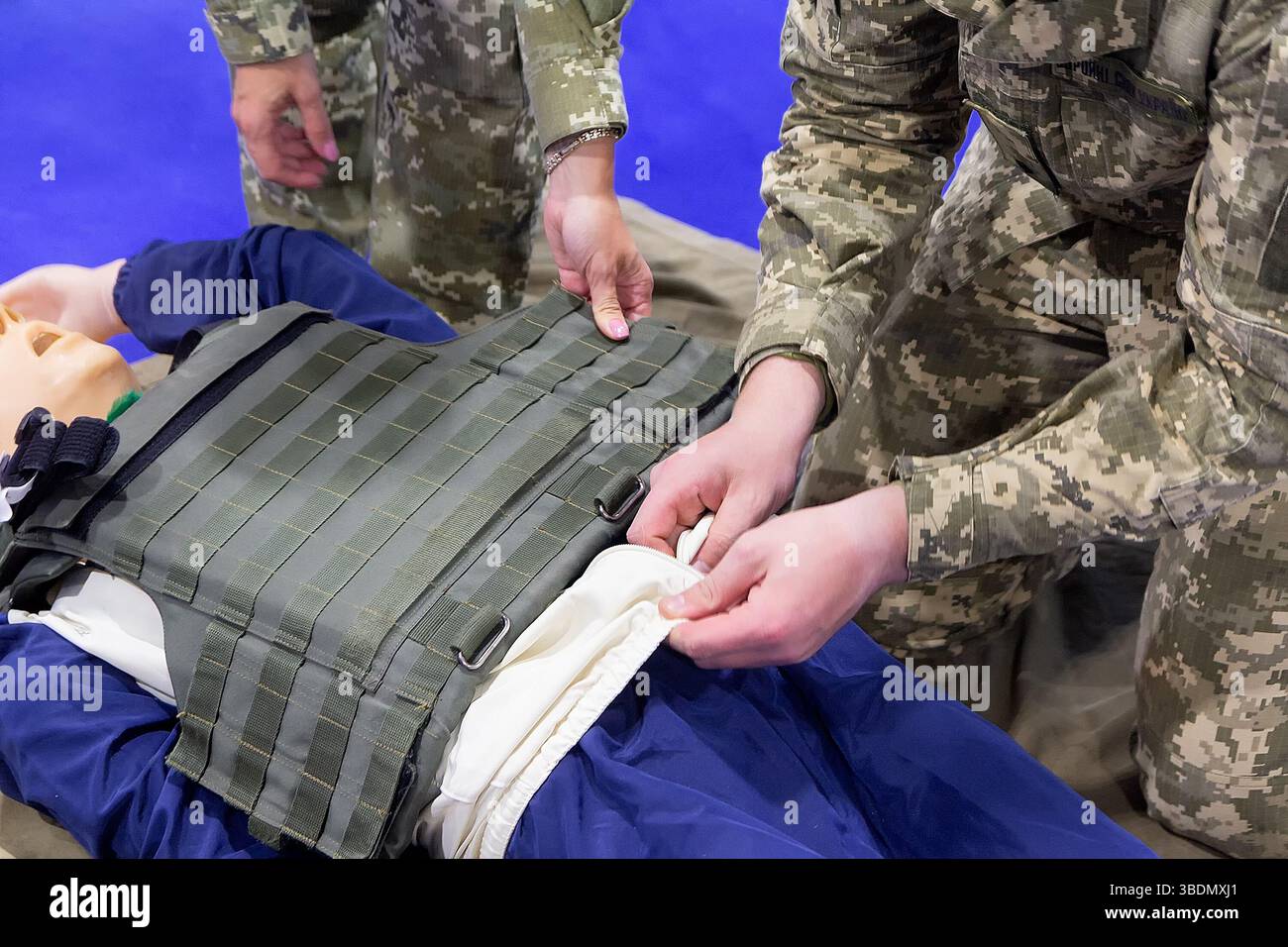 A man in military uniform conducts a master class on medical care on a ...