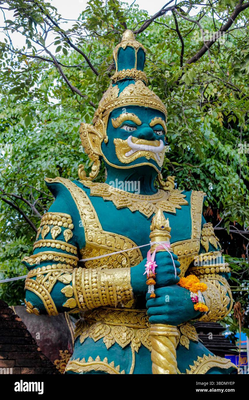 Colorful guard Yaksha statue in a Buddhist temple Wat in Thailand ...