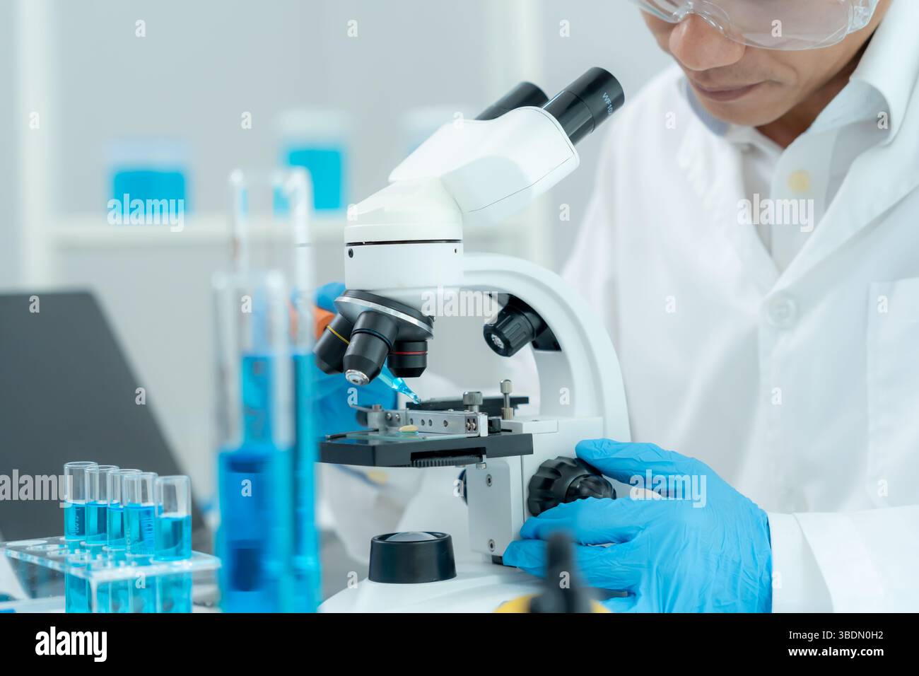Scientist check chemical food residues in laboratory. Control experts inspect quality of fruits ...