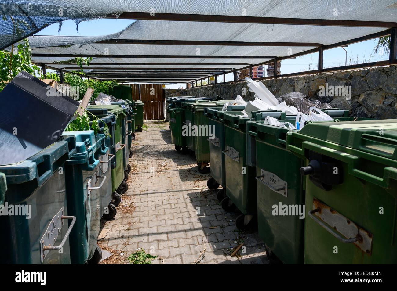 Garbage containers lined up on a residential street in Cyprus Stock ...