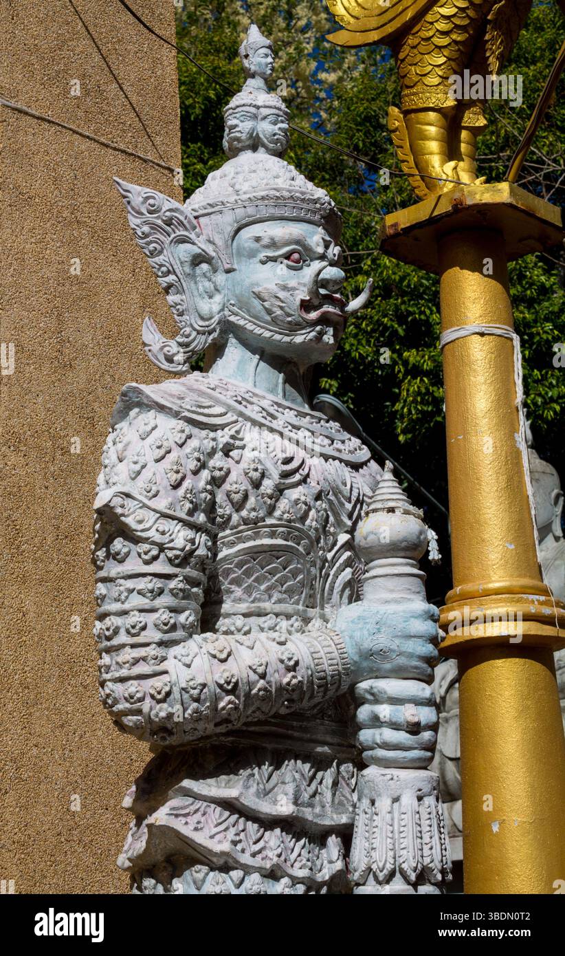 Colorful guard Yaksha statue in a Buddhist temple Wat in Thailand ...
