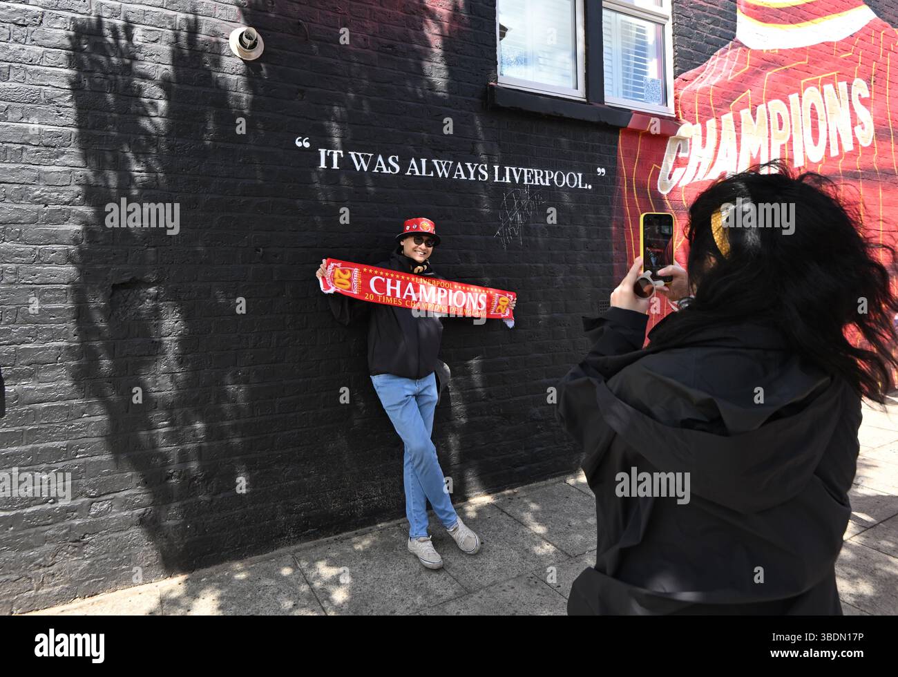Liverpool fan poses for a photo before the Premier League match at ...